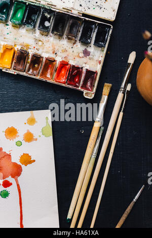 Crop view of watercolor palette and brushes Stock Photo - Alamy
