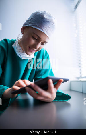 Young woman dermatologist using computer with patient during ...