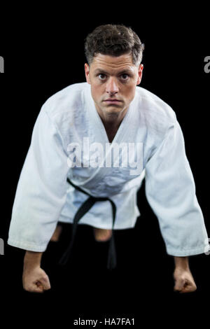 Karate player doing push-up Stock Photo - Alamy