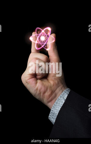Man holding atom symbol with radiation warning sign on dark blue ...