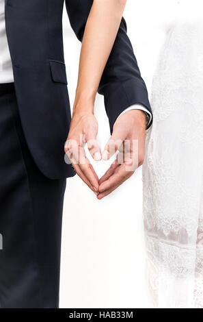 bride and groom hands making heart together Stock Photo - Alamy