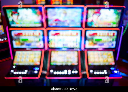 Blurry image of slots machines at the Casino Stock Photo - Alamy