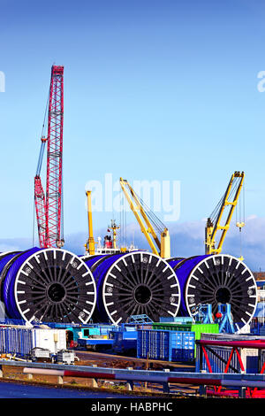 Giant Reels being loaded onto a tanker in port Stock Photo - Alamy