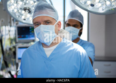 Team doctor and assistant holding oxygen mask with patient emergency in ...
