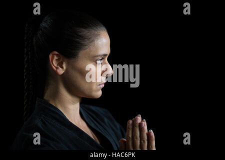 Karate player in prayer pose Stock Photo: 126886230 - Alamy