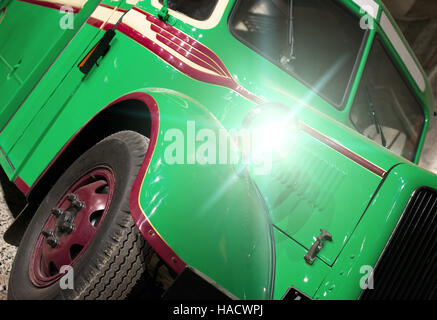 Part of green retro bus with passenger seats Stock Photo - Alamy