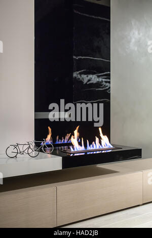 Interior of modern room with stylish bicycle, folding screen and ...