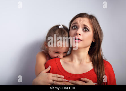 Angry emotional kid girl wanting to bite and terroring her shocked ...