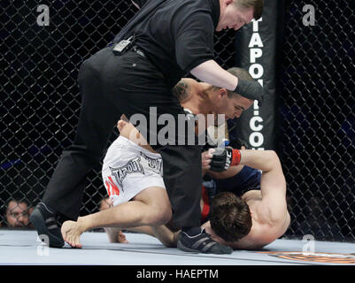 Aaron Riley, right, is stopped by referee during fight against Shane ...