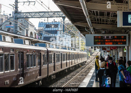 Japan, Shukugawa, Hankyu railway station. View along train and platform ...