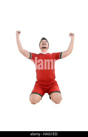 Image of winning football player after scoring isolated over white ...