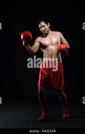 Portrait of asian guy boxer is celebrating his winning over black ...
