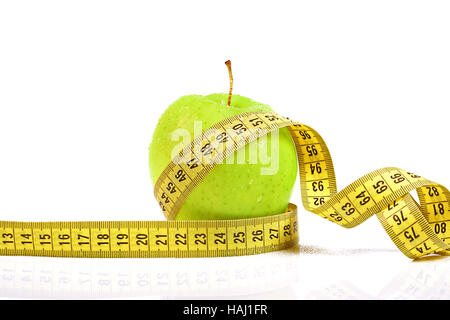 Sport lifestyle and weight loss concept. Measuring tape, dumbbells ...