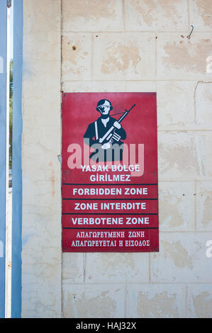 Military Zone sign warning on net grid Stock Photo - Alamy