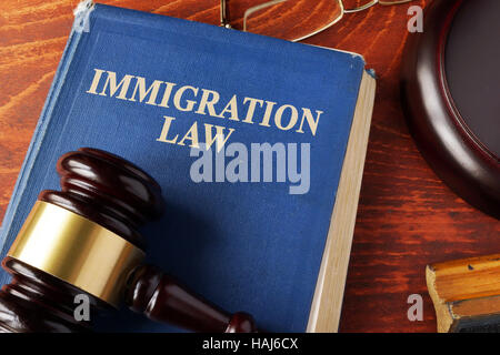 Immigration law or rules book on the shelf Stock Photo - Alamy