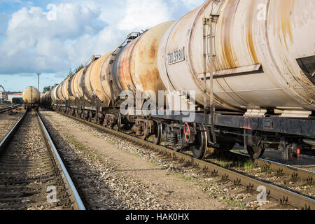 railroad transportation, freight cars in industrial seaport at sunset ...