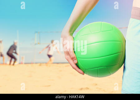 Friends playing on the beach Stock Photo - Alamy