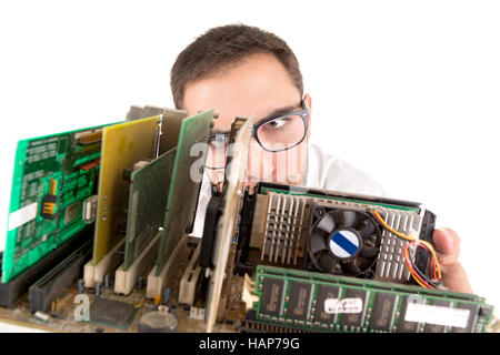 Nerd engineer posing with computer components isolated in a white ...