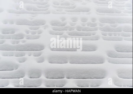 Close up of the clean snowy lines of a snow drift on a winter day Stock ...