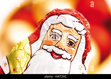 Chocolate Father Christmas wrapped in foil Stock Photo - Alamy