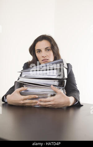Pretty clerk is overworked Stock Photo - Alamy