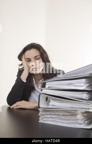 Pretty clerk is overworked Stock Photo - Alamy