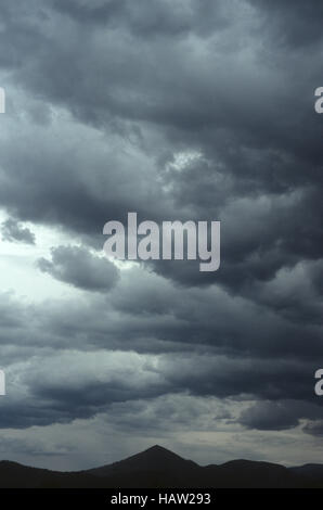 Unusual layers of clouds, dark grey above and white below just above ...