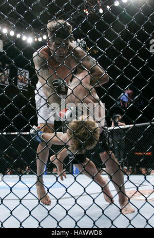 Kendall Grove, top, fights Jake Rosholt at UFC 106 at the Mandalay ...