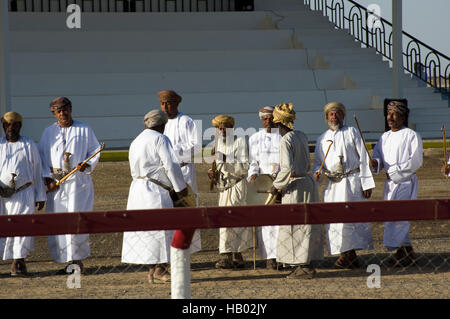 Musicians playing and singing traditional Omani music with instruments ...