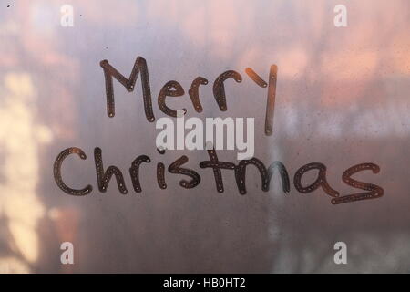 MERRY CHRISTMAS text written on green-black round stamp sign Stock ...