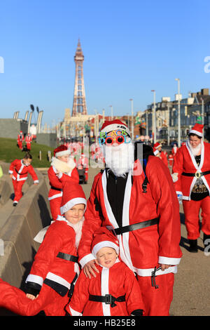 Blackpool, UK. 4th Dec, 2016. people on the sea front dressed in santa ...