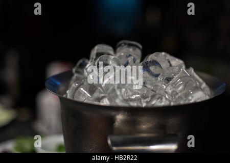Metal bucket with ice cubes isolated on white Stock Photo - Alamy