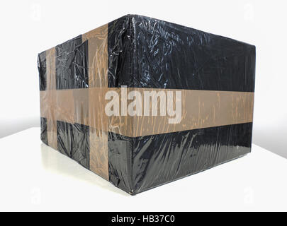 Black packet parcel Stock Photo - Alamy