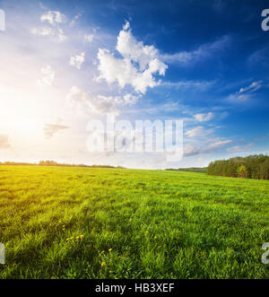 Beautiful sunset on the field in Őrség Hungary with sunbeams and bales ...