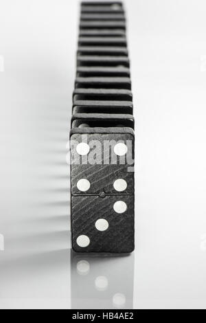Composition of standing black domino bricks with white dots Stock Photo ...