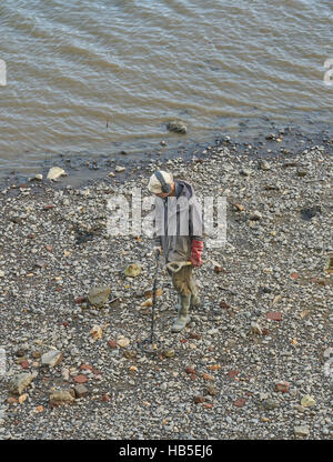 metal detectoring on river. Metal detector. Thames Mudlarking Stock ...
