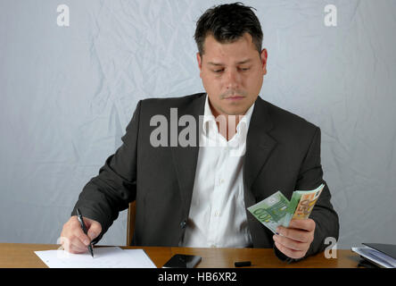 Young business man with money Stock Photo - Alamy