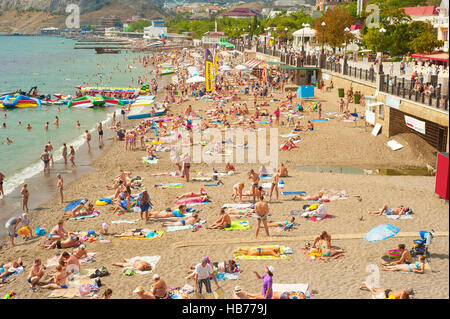 People at a sea beach in Sudak. Crimea, Russia Stock Photo - Alamy