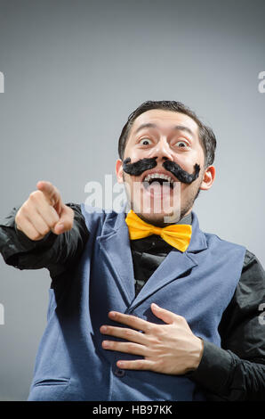 Funny man against dark background Stock Photo - Alamy
