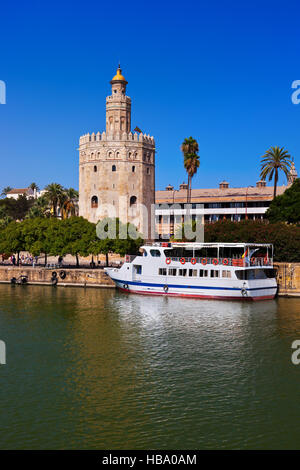 The Golden Tower in Seville. The embankment in the capital of Andalusia ...