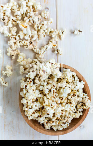 top view of popcorn in a bowl on color background Stock Photo - Alamy