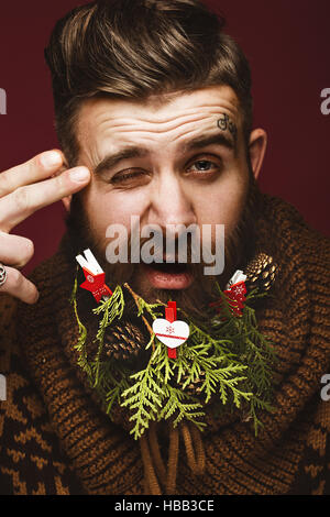 Portrait of a brutal Santa Claus. Beard with bauble. Santa in barber ...