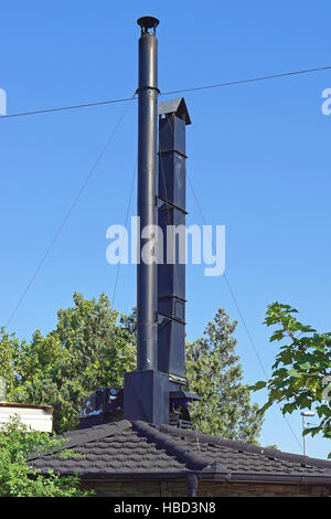 Two black metal chimney pipes at grill Stock Photo - Alamy