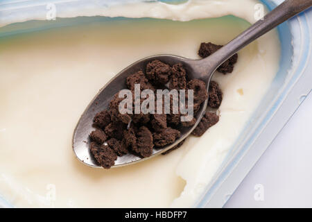 pot of new Oreo vanilla flavour yogurt with Oreo cookie crumb isolated ...