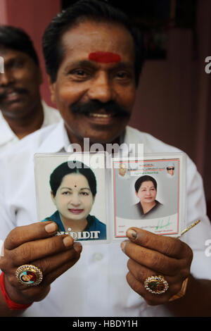 A devotee of Jayalalitha Jayaraman, former actress, state minister of Tamil Nadu, shows off his ...