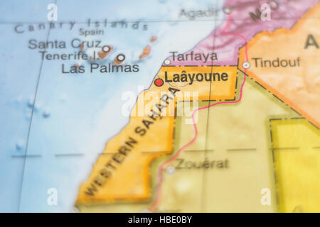 Close up to a Laayoune city with a red pin needle into Western Sahara ...