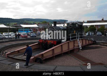 steam locomotive being turned on a manual railway turntable on the ...