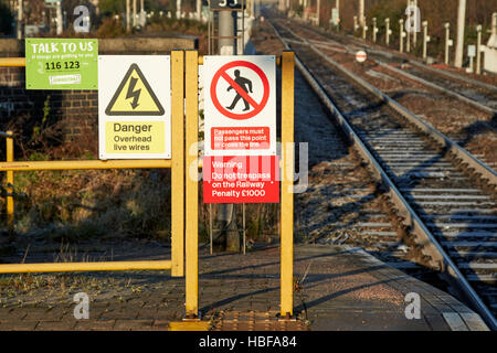 train station platform warning signs danger Stock Photo - Alamy