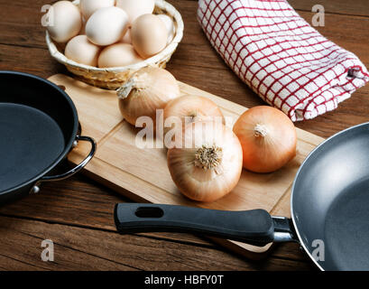 still-life with onion pans and chicken eggs Stock Photo - Alamy