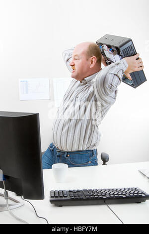 angry businessman throwing keyboard at computer screen Stock Photo - Alamy